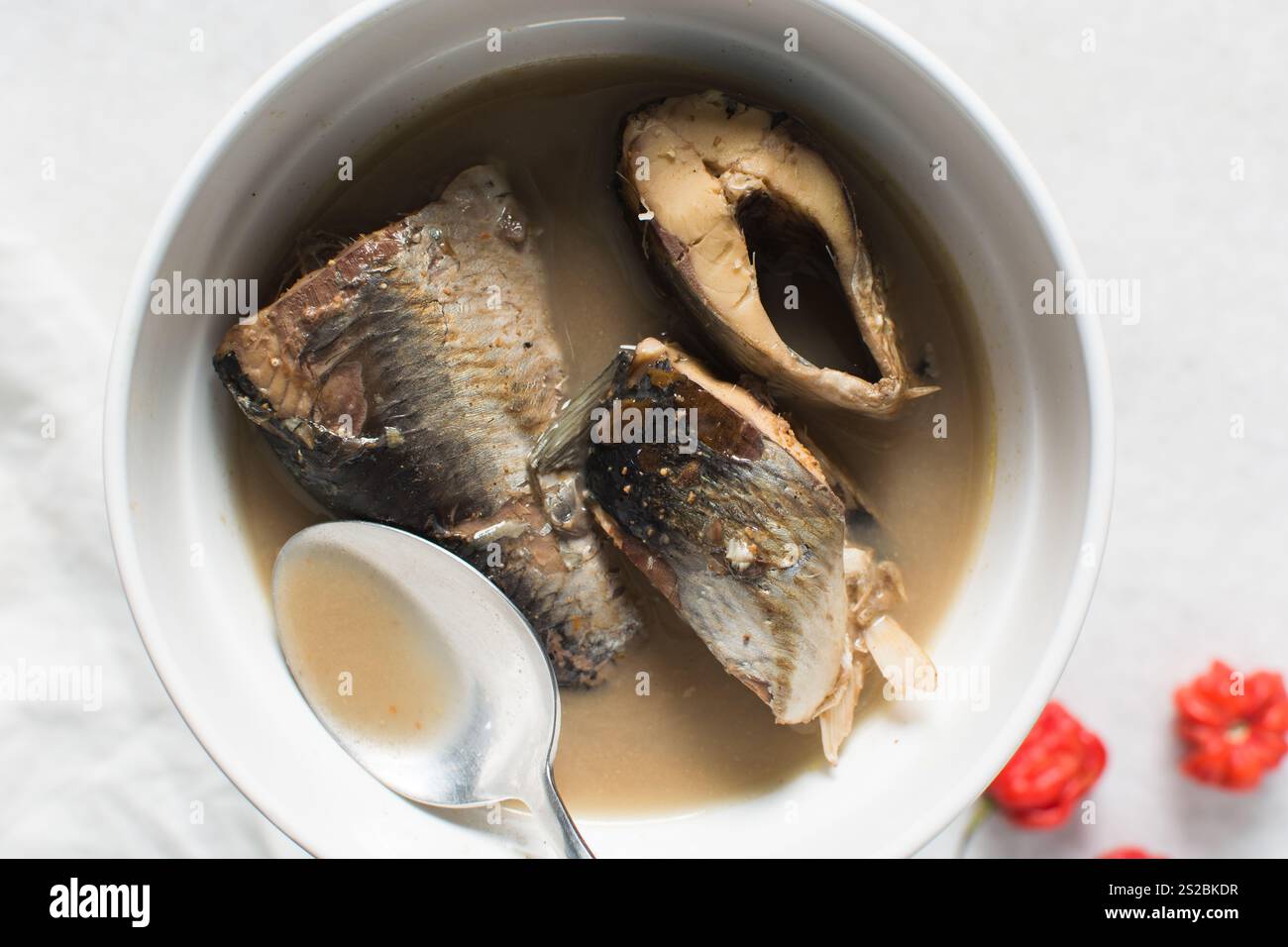 Overhead view of Nigerian pepper soup with fish, top view of fish ...