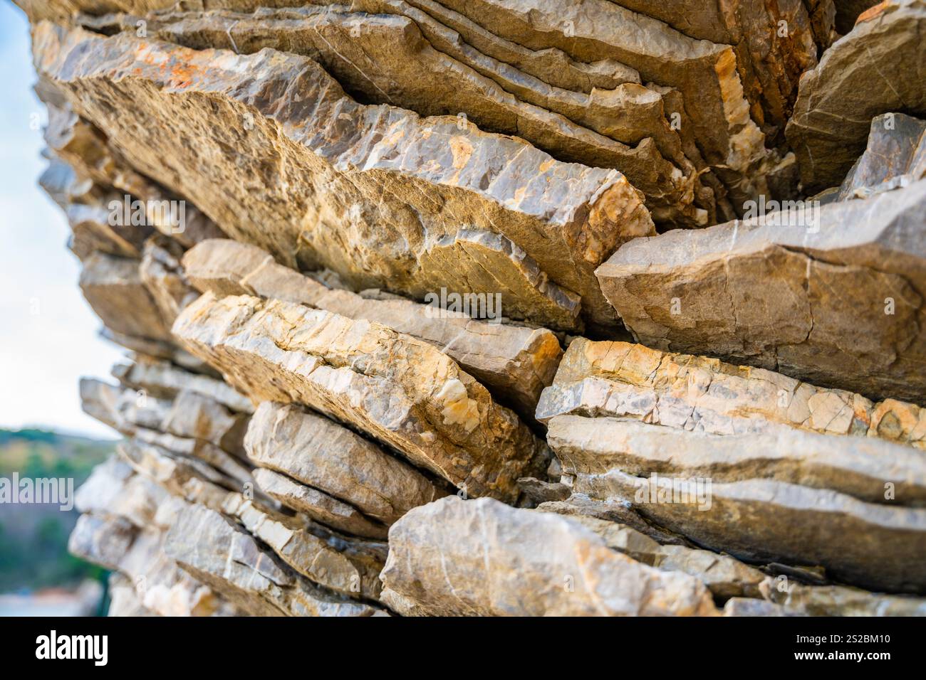 Layered rock texture in Budva, Montenegro. Sedimentary rocks with ...