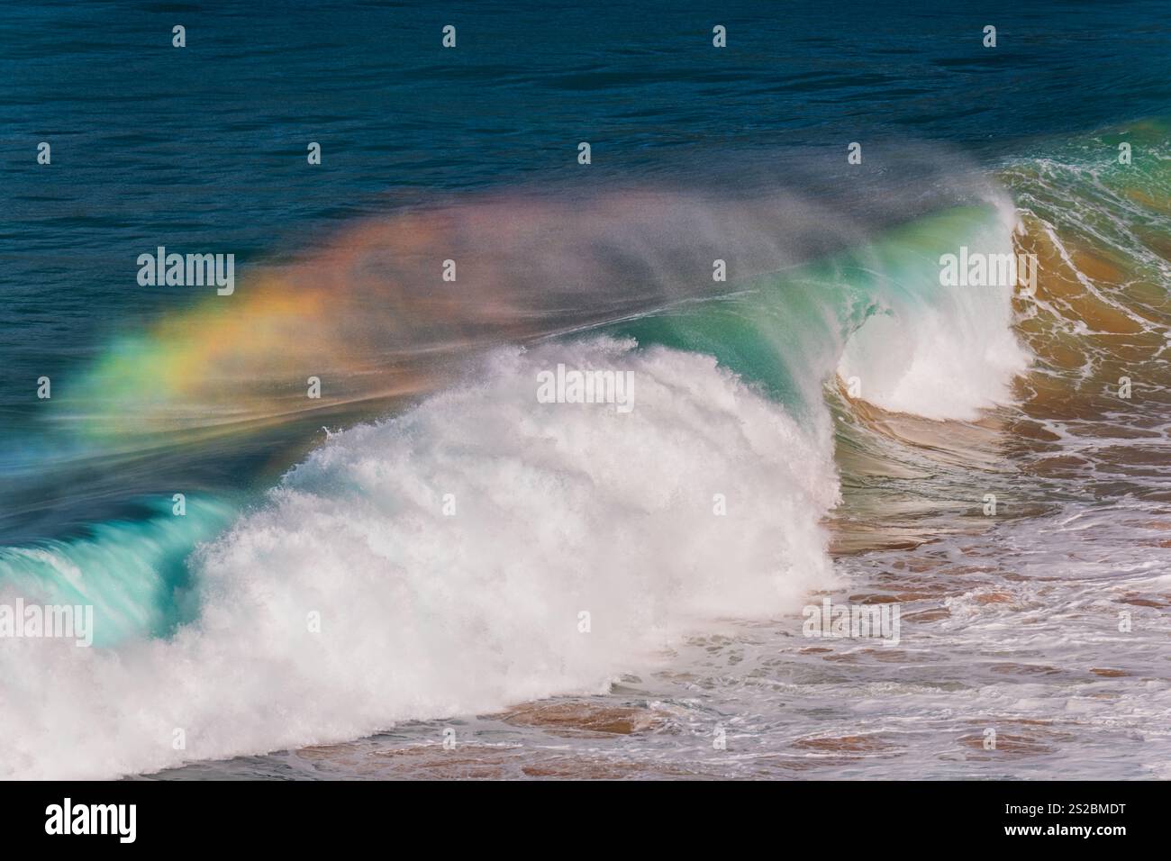 Sea water rainbows in the waves at Whale Beach in the Northern Beaches ...