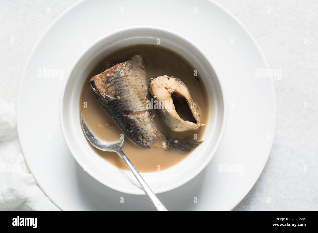 Overhead view of Nigerian pepper soup with fish, top view of fish ...