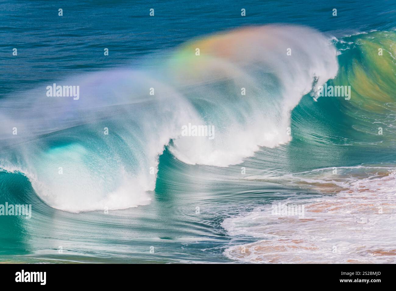 Sea water rainbows in the waves at Whale Beach in the Northern Beaches ...