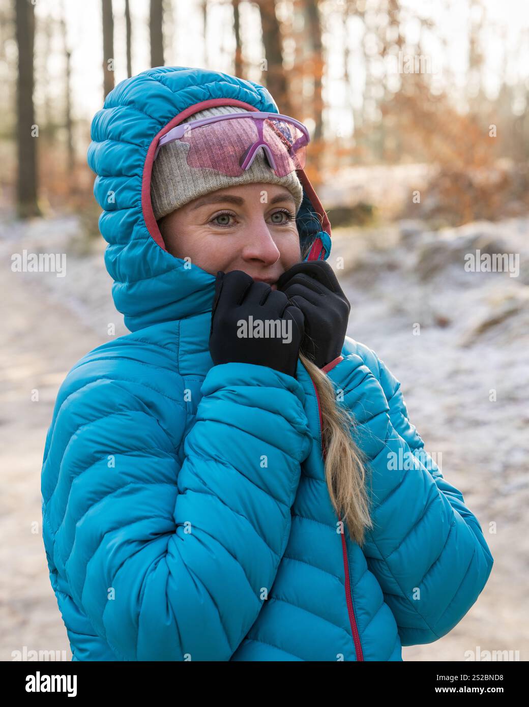 Cute slim girl walking in forest in snowy weather.Cold weather, snow ...