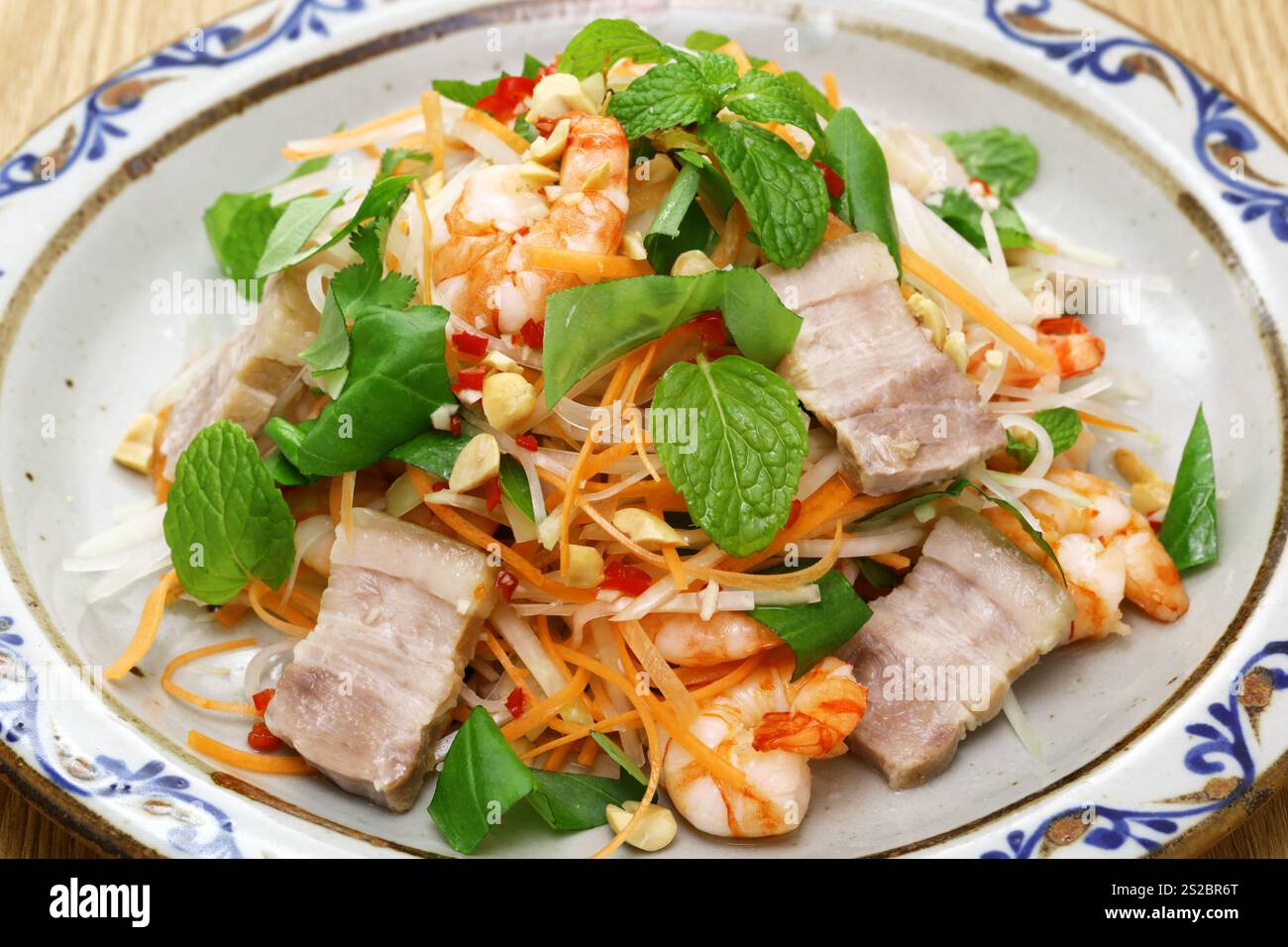 Green papaya salad with prawn and pork, Vietnamese cuisine Stock Photo ...