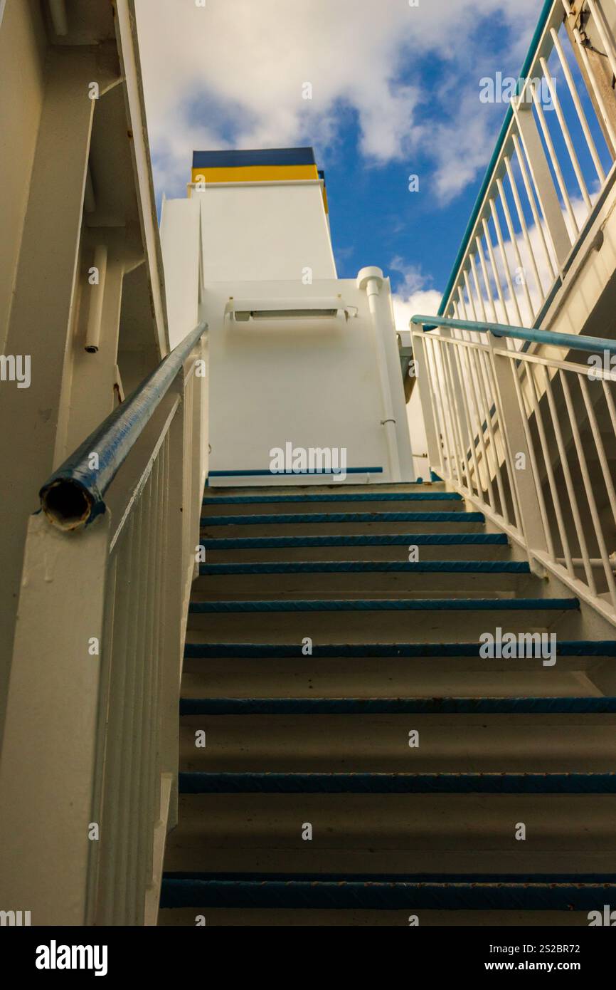 Perspective view of a staircase on a ship, featuring blue steps with a ...