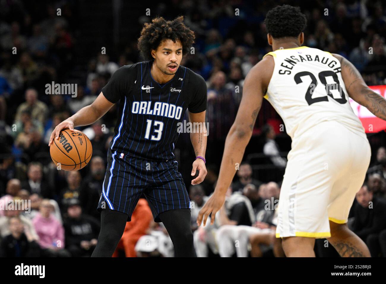 Orlando Magic guard Jett Howard (13) is defended by Utah Jazz forward ...