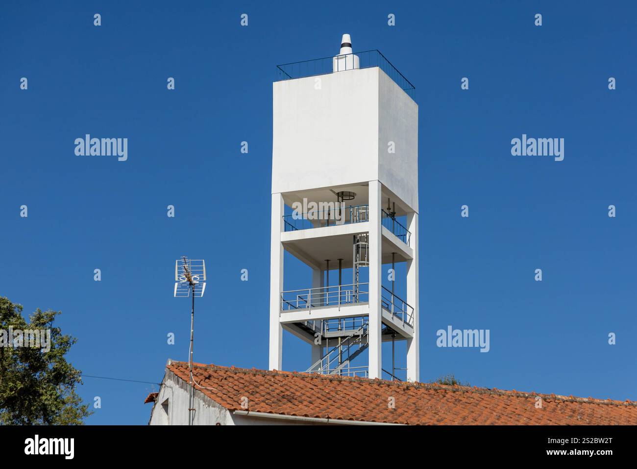 Square white water tower in a village of Portugal Stock Photo - Alamy