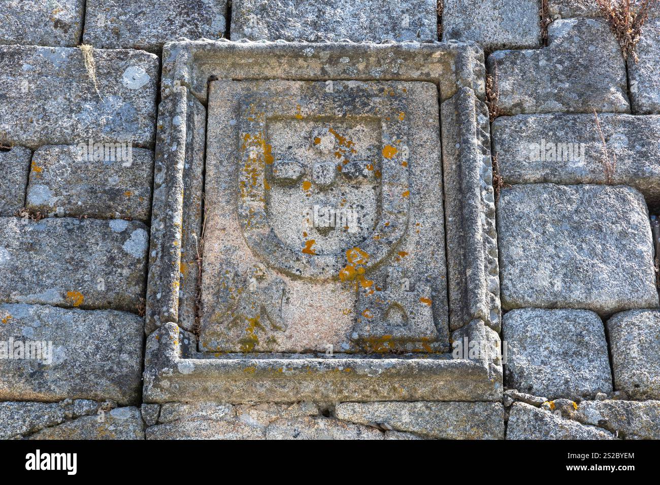 Granite logo emblem above the entrance of the castle in Trancoso ...