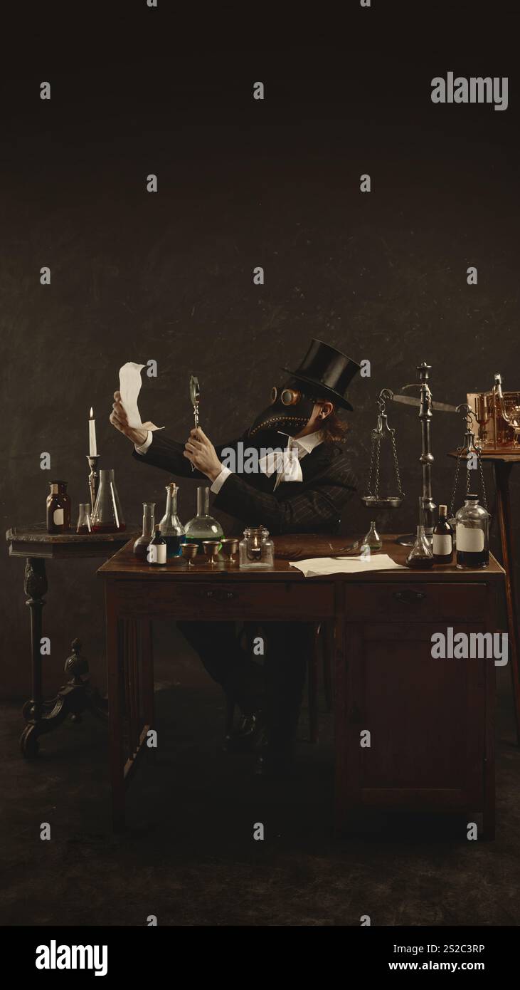 Plague doctor dressed in suit sits at table in vintage laboratory and ...