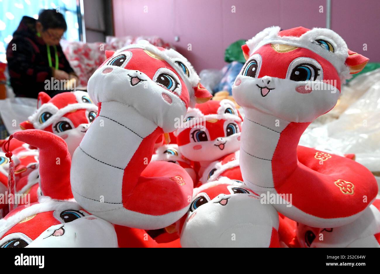 HANDAN, CHINA - JANUARY 7, 2025 - A worker produces a Chinese zodiac ...