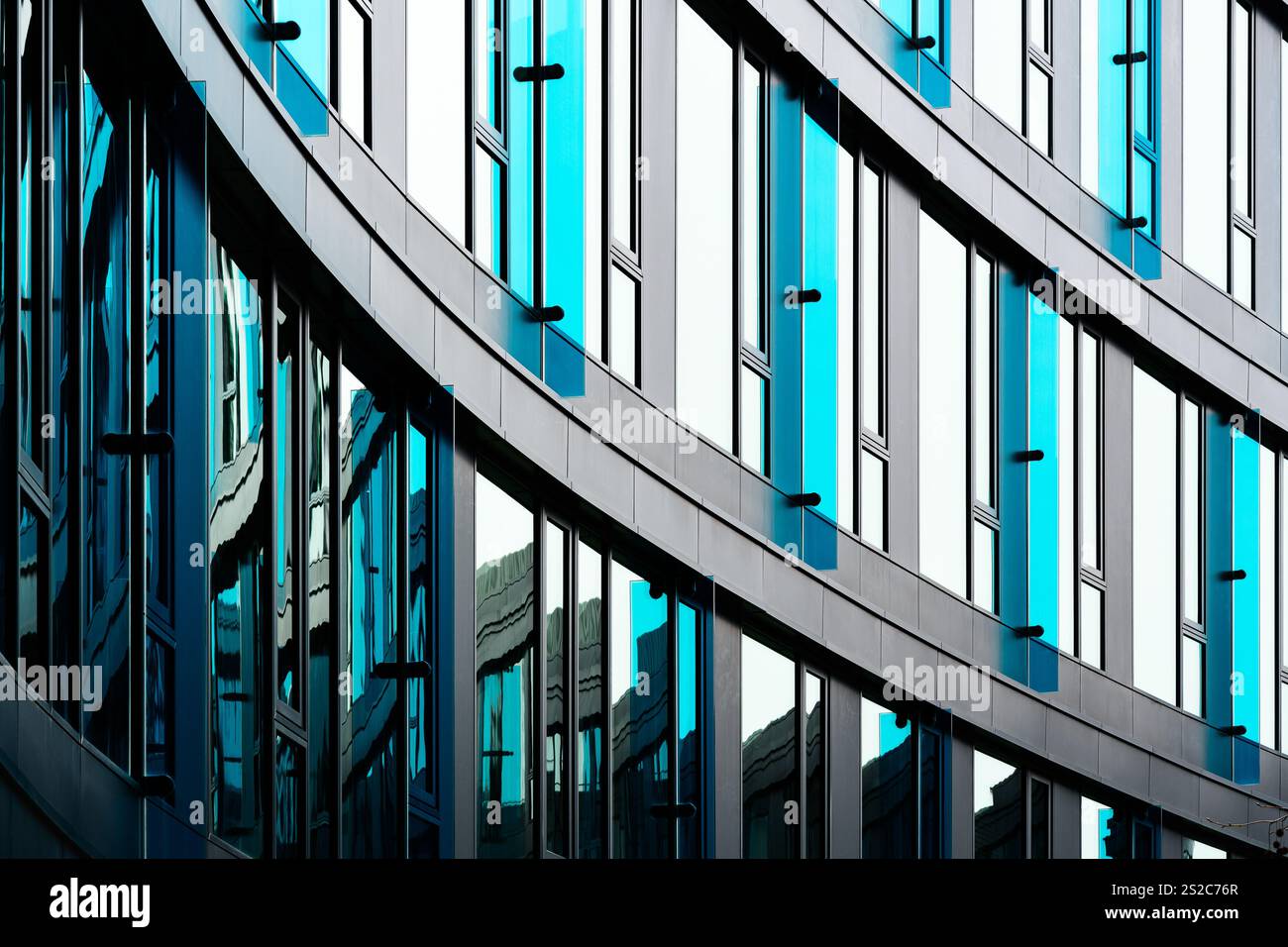 Modern Glass Office Building with Blue-Tinted Windows and Sleek ...