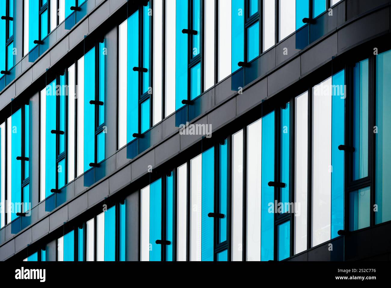 Modern Glass Office Building with Blue-Tinted Windows and Sleek ...