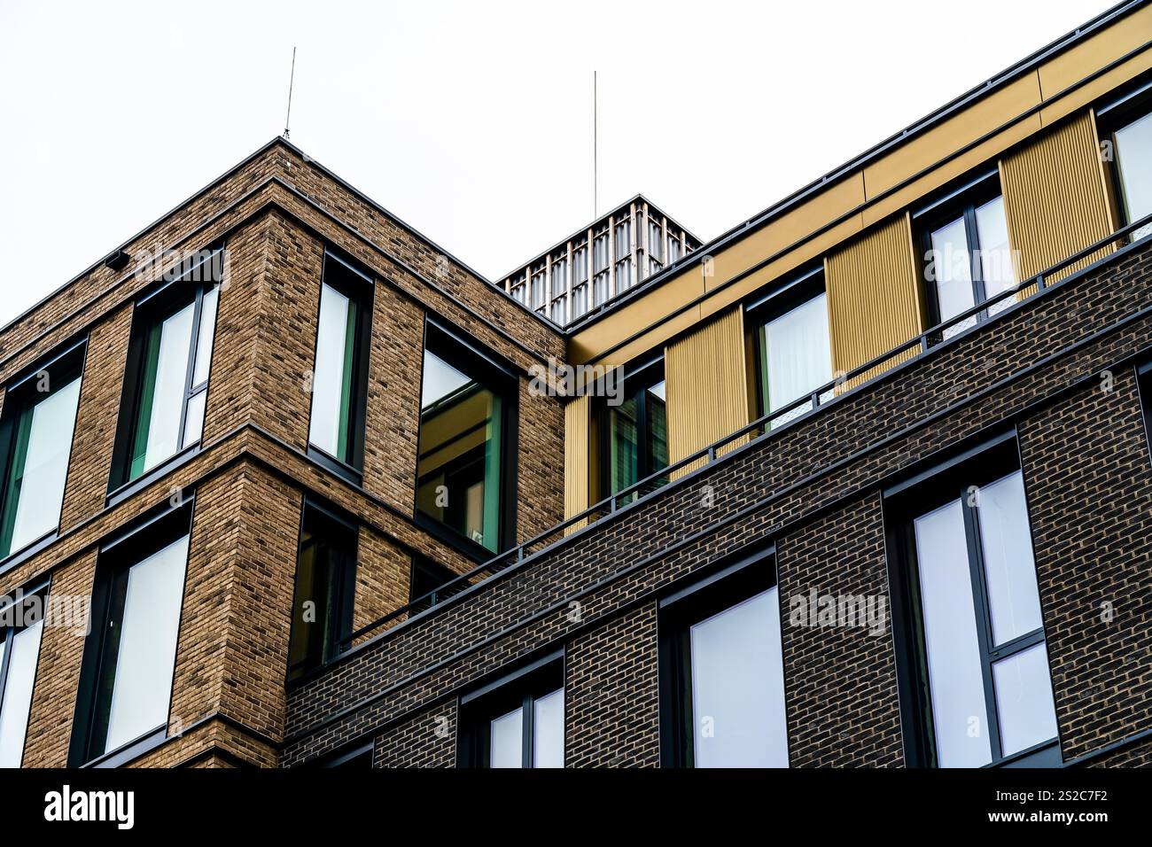 Modern Urban Building with Brick Facade, Large Windows, and Yellow ...