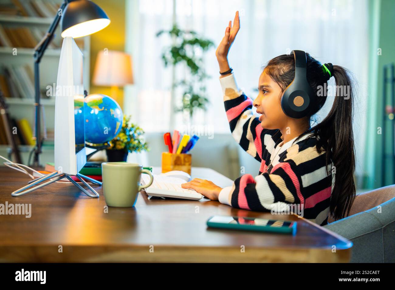 Studious Indian Asian Elementary Grade Girl Attending Virtual Online ...