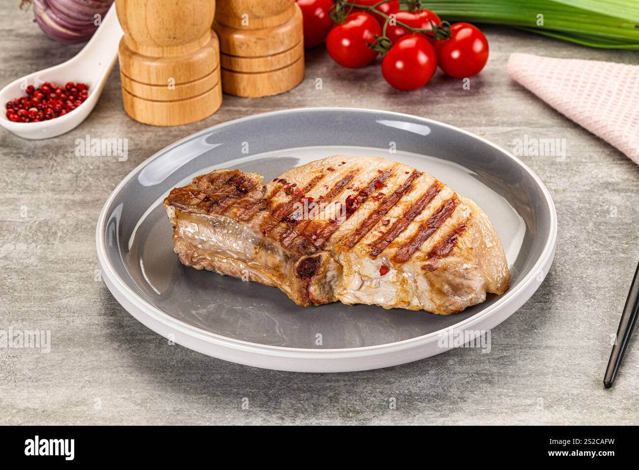 Grilled fat pork loin steak with bone Stock Photo - Alamy