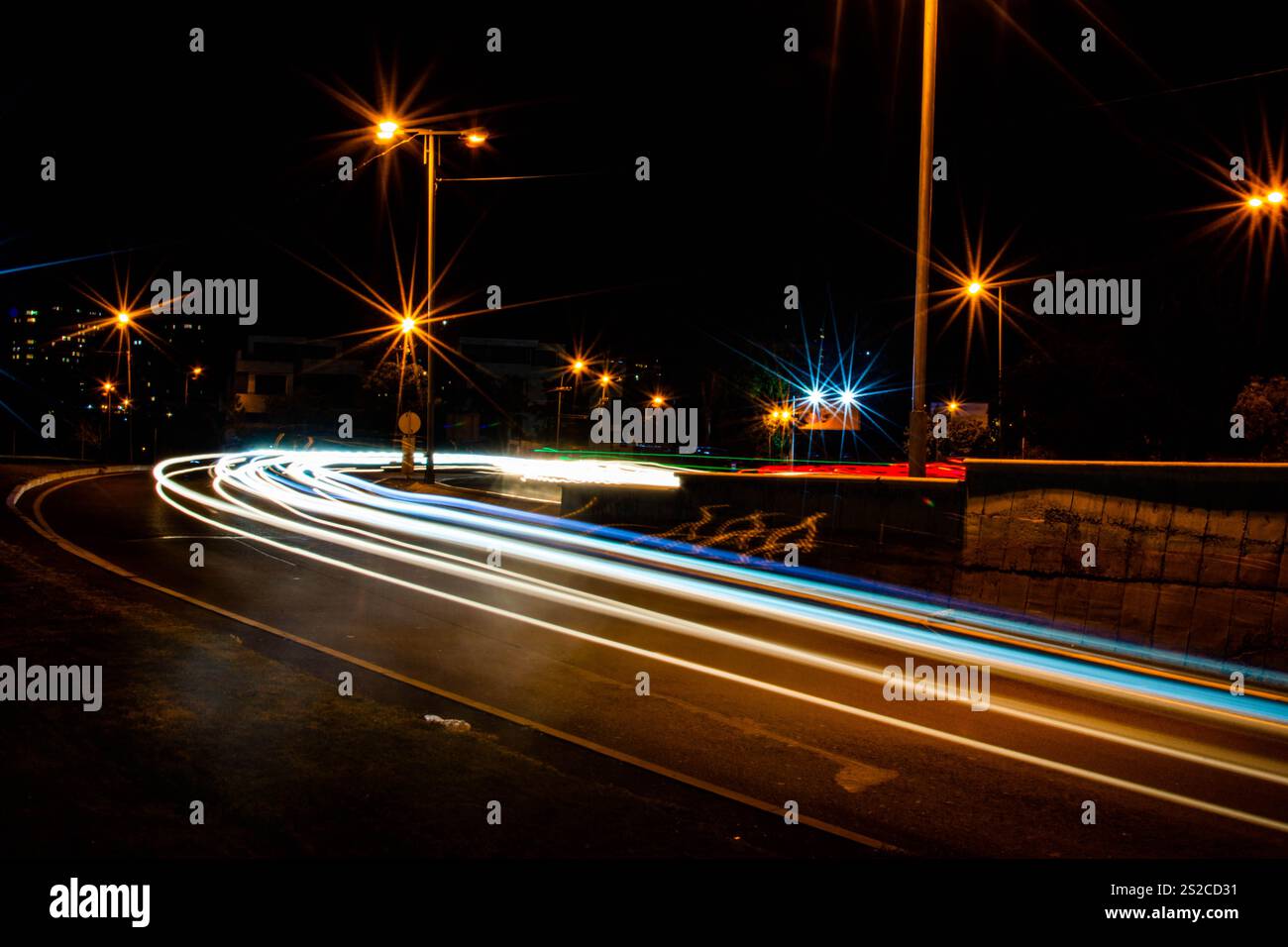 Car traffic on highways in the city at night. The movement of cars on ...
