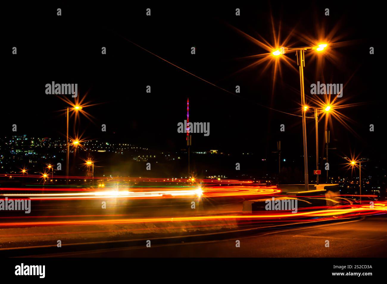 Car traffic on highways in the city at night. The movement of cars on ...