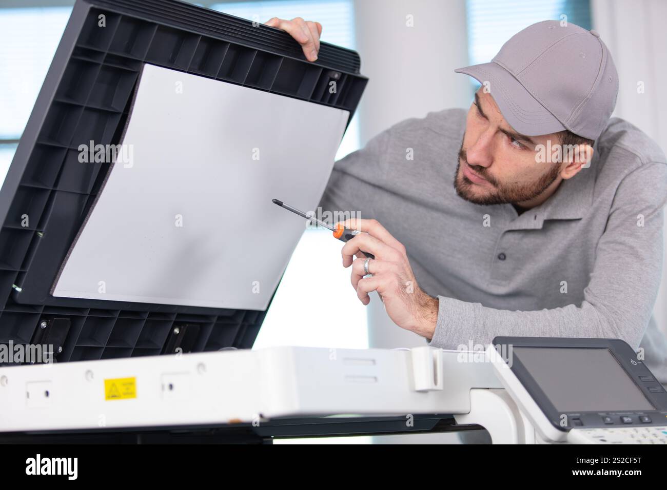 professional young engineer checking 3d-printer Stock Photo - Alamy