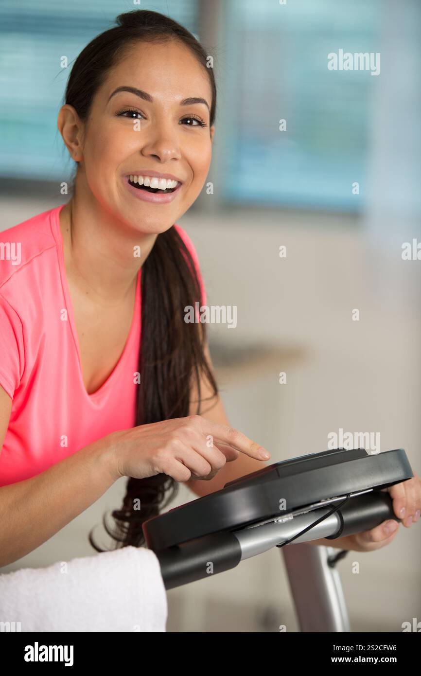 Woman programming exercise machine hi-res stock photography and images - Alamy