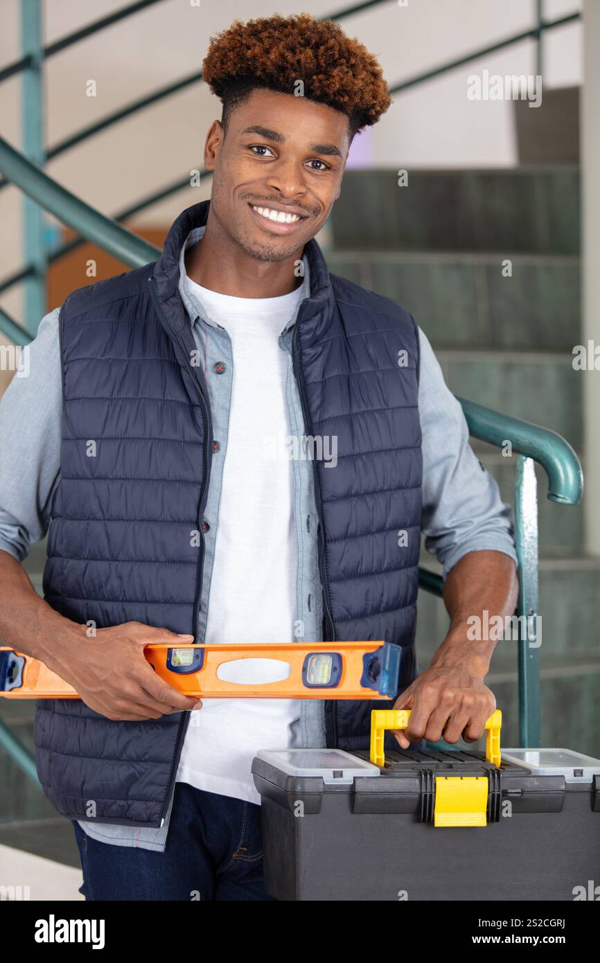 worker man holding spirit level tool and working tool box Stock Photo ...