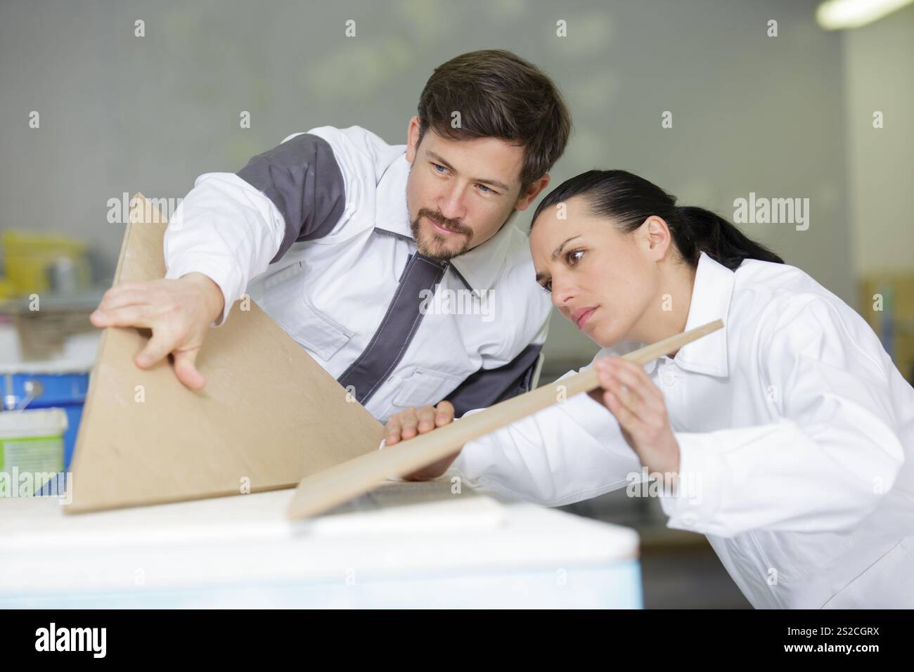 decorating team using wooden templates Stock Photo - Alamy