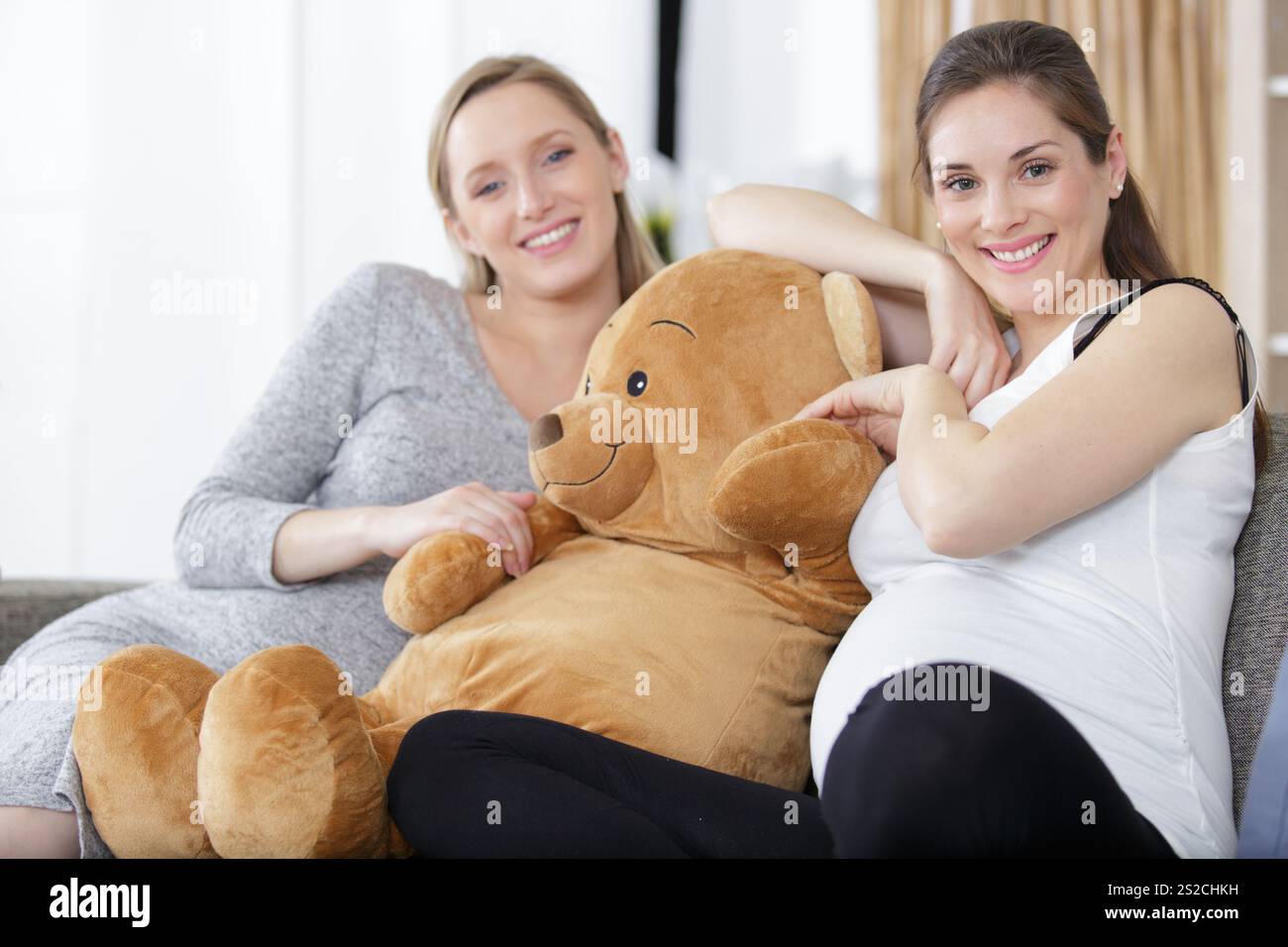 pregnant women nex to the tedy bear Stock Photo - Alamy