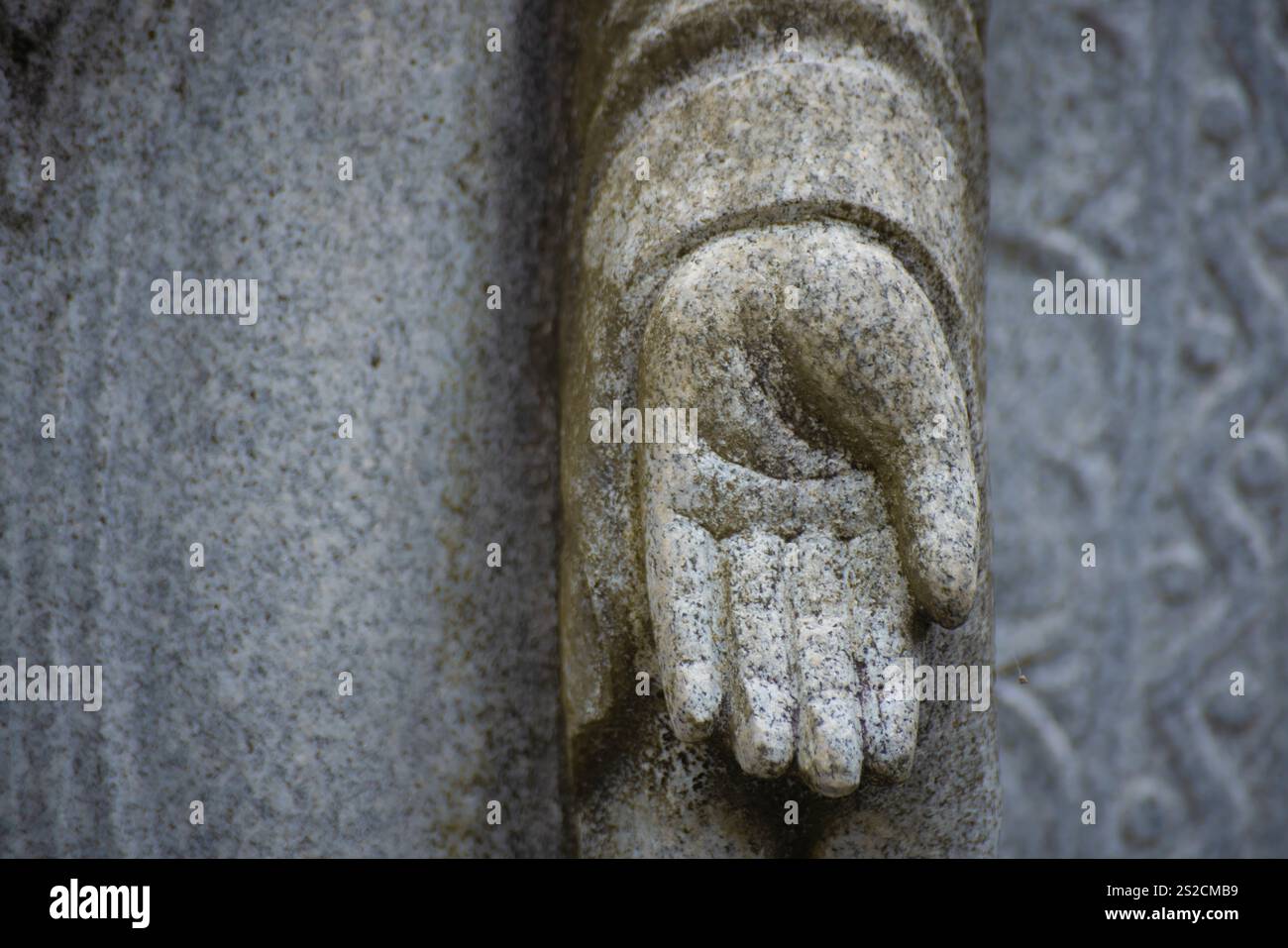 A religious stone statue of Shaka Nyorai at Japanese buddhism temple ...