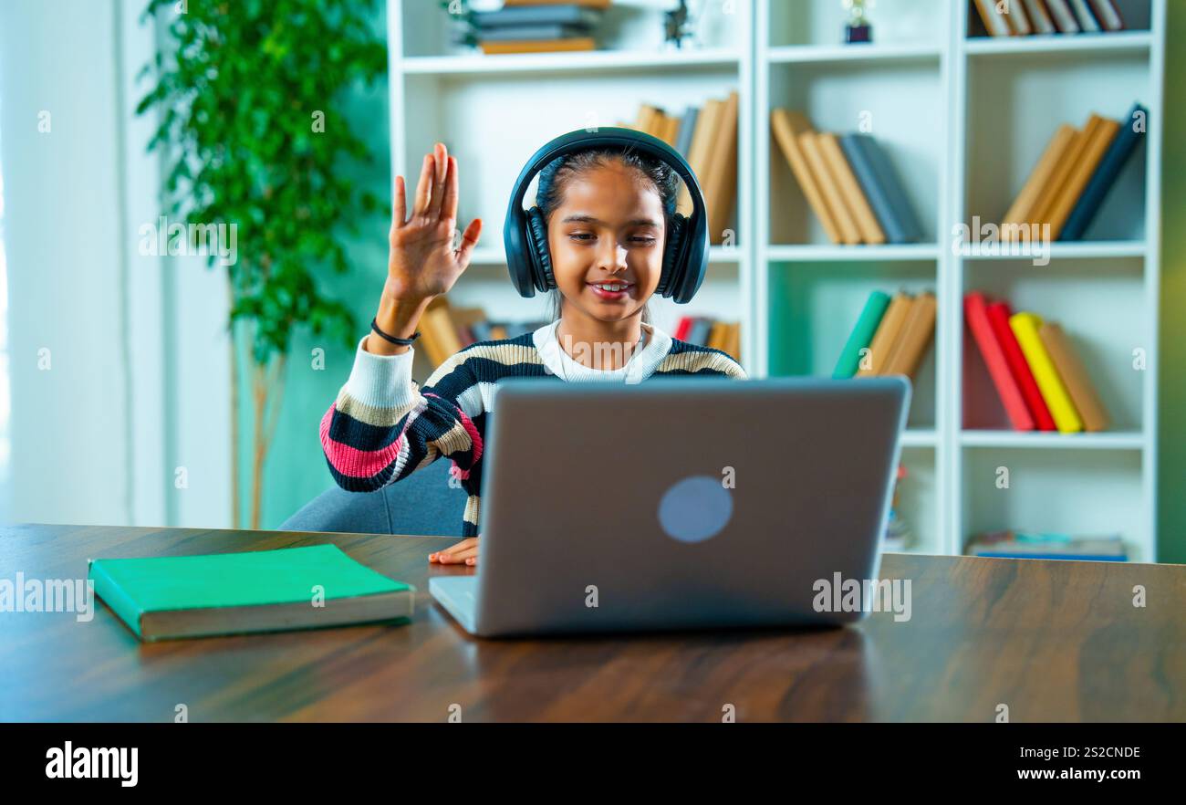 Studious Indian Asian Elementary Grade Girl Attending Virtual Online ...