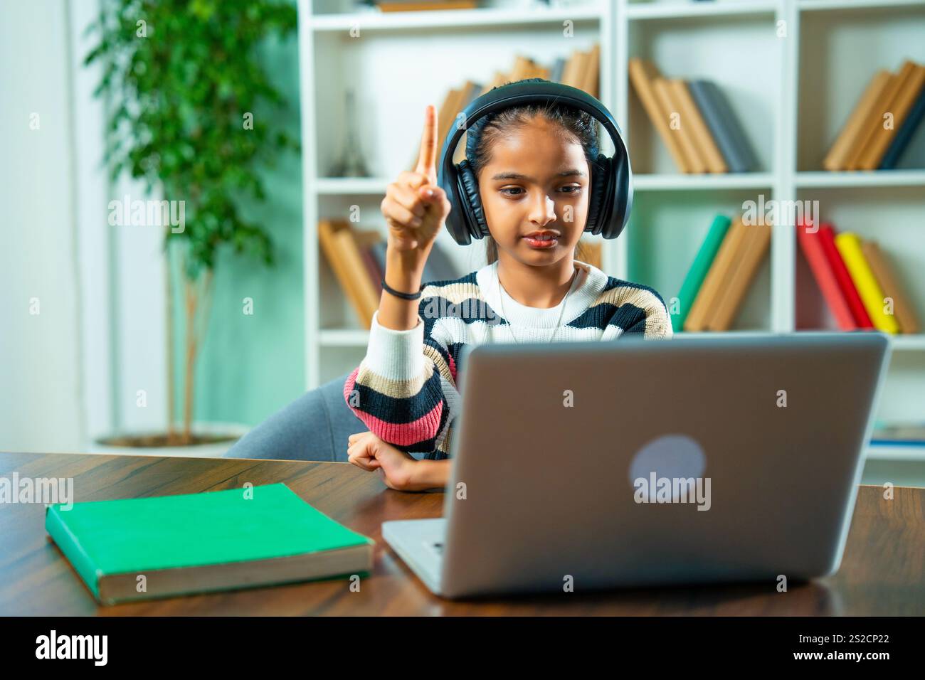 Studious Indian Asian Elementary Grade Girl Attending Virtual Online ...