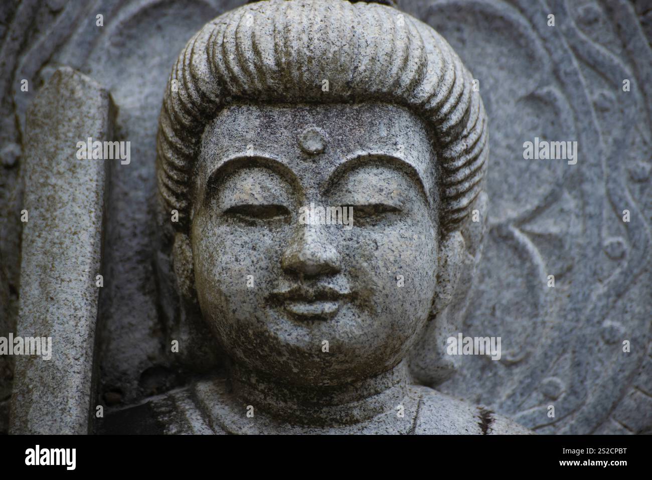 A religious stone statue of Manjusri at Japanese buddhism temple Stock ...