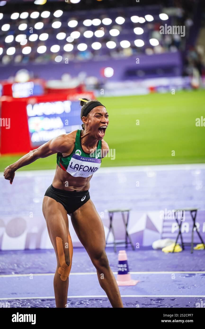 Thea LaFond celebrating her medal with her country's flag at the Paris ...