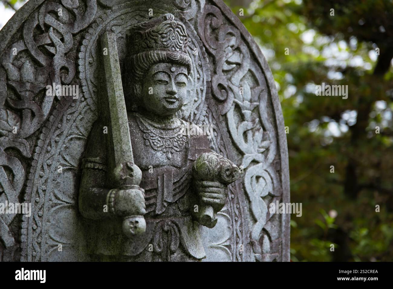 A religious stone statue of Akasagarbha at Japanese buddhism temple ...
