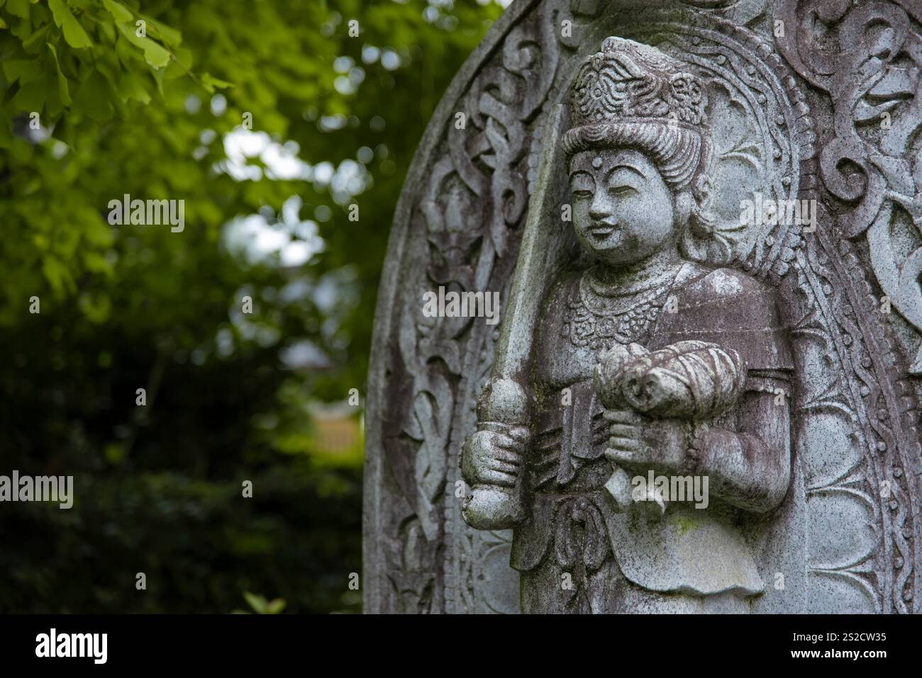 A religious stone statue of Akasagarbha at Japanese buddhism temple ...
