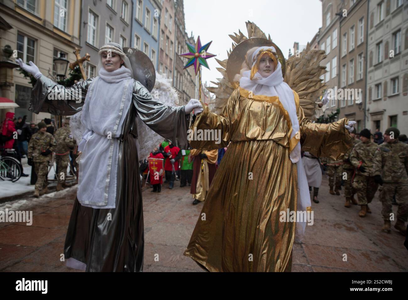 Gdansk, Poland. 07th Jan, 2025. Actors dressed as angels walk through ...