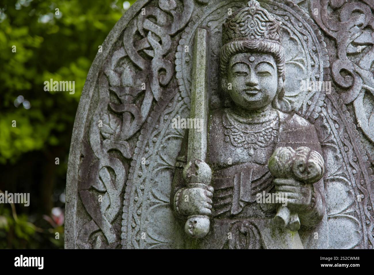 A religious stone statue of Akasagarbha at Japanese buddhism temple ...