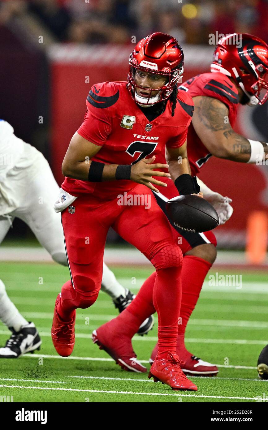 Houston Texans quarterback C.J. Stroud (7) hands off the ball against ...