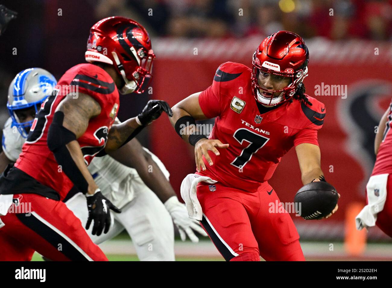 Houston Texans quarterback C.J. Stroud (7) hands off the ball against ...