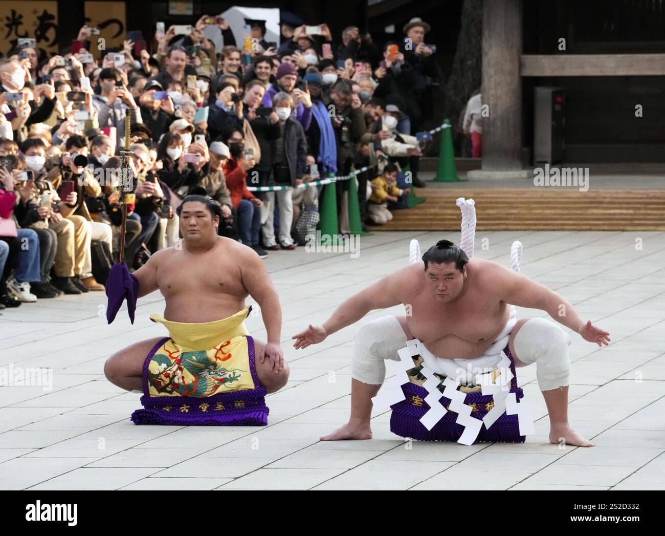 Sumo grand champion Terunofuji (R) performs a ring-entering ritual at ...