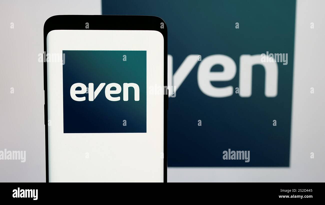 In this photo illustration, a mobile phone with the logo of company ...