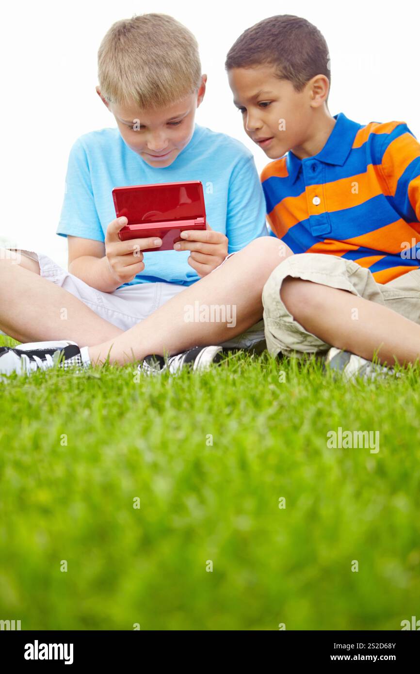 Outdoor, friends and kids with gaming console for playing together ...