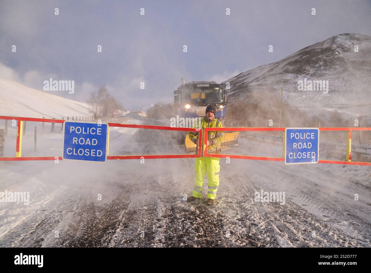 A snow plough driver at the closed snow gates on the A93 in Spittal of ...