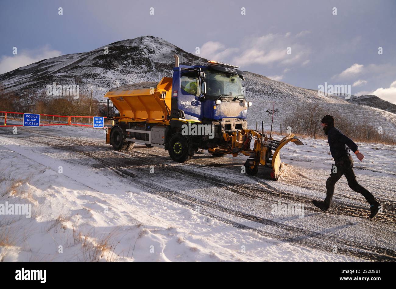 A snow plough driver at the closed snow gates on the A93 in Spittal of ...