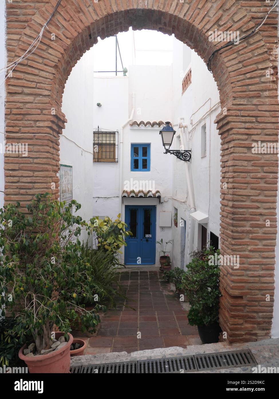 Old historical gate entrance to a house in Competa a white town in ...