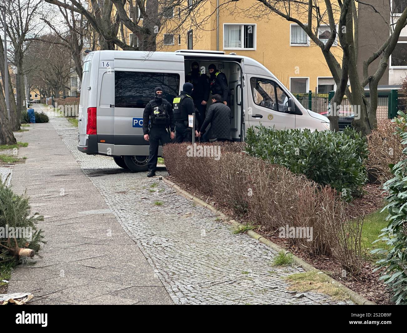 Berlin, Germany. 07th Jan, 2025. Police officers stand by their vehicle ...