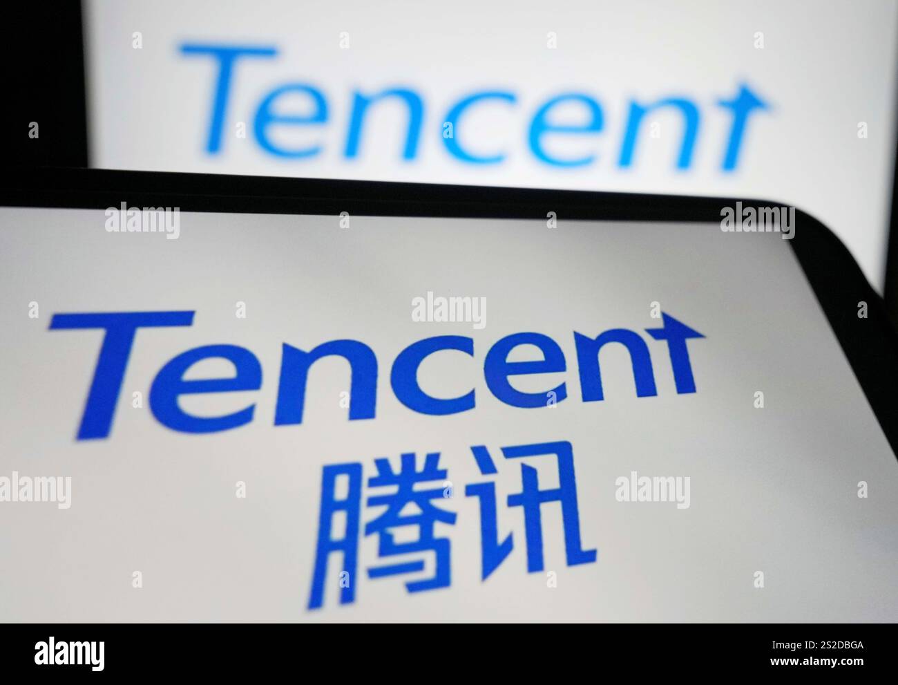 The logo of Chinese IT company "Tencent" are displayed on the screens ...