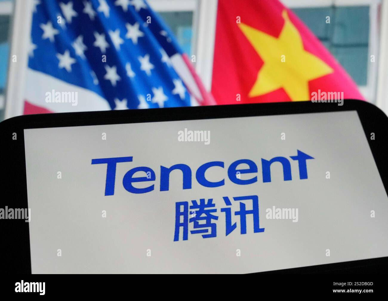The logo of Chinese IT company "Tencent" is displayed on the screen of smartphone in Beijing ...