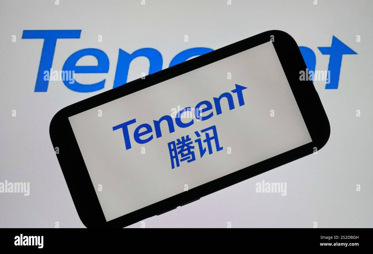 The logo of Chinese IT company "Tencent" are displayed on the screens ...
