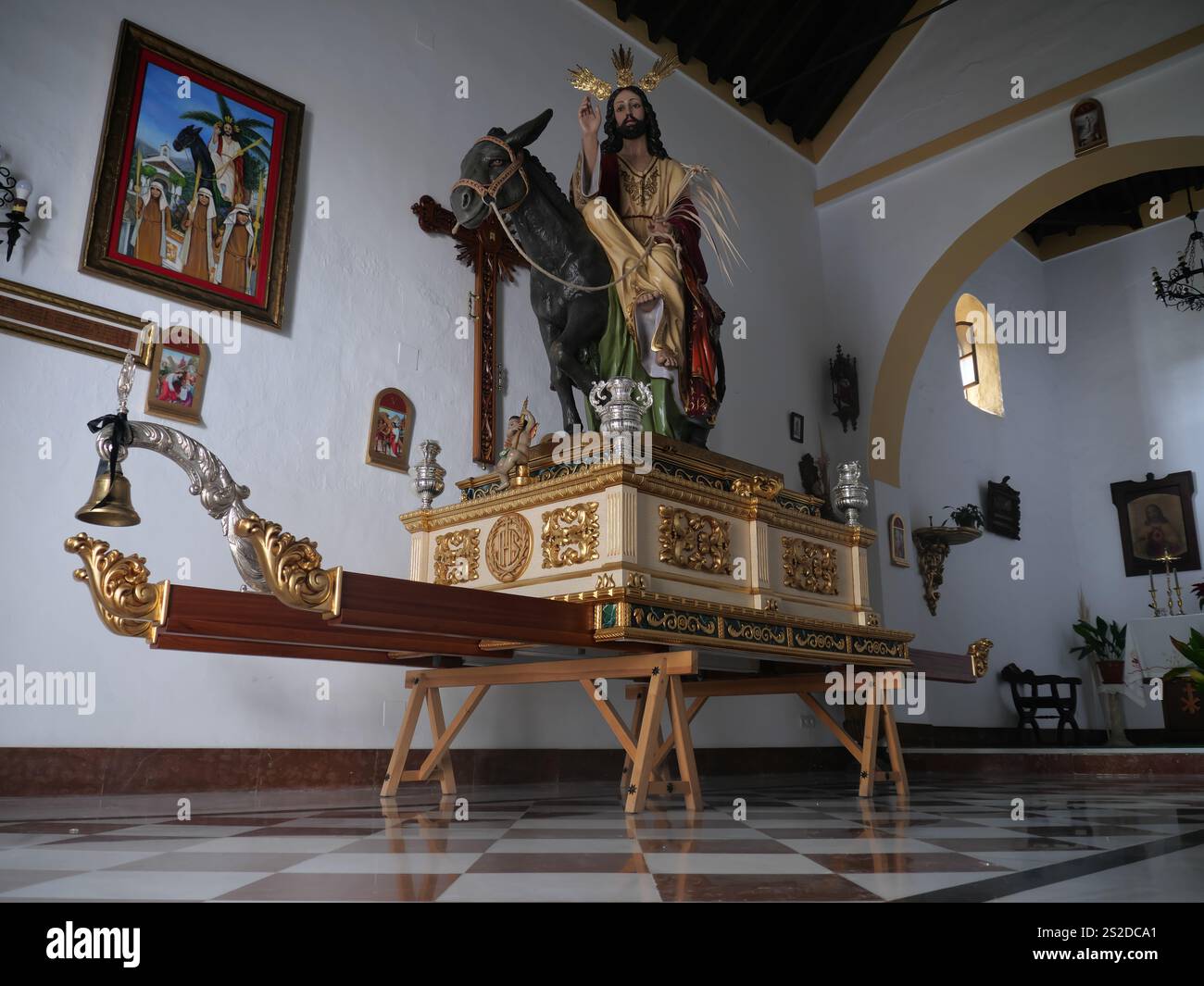 A carved Jesus figure on a donkey in a church of Competa a white town ...