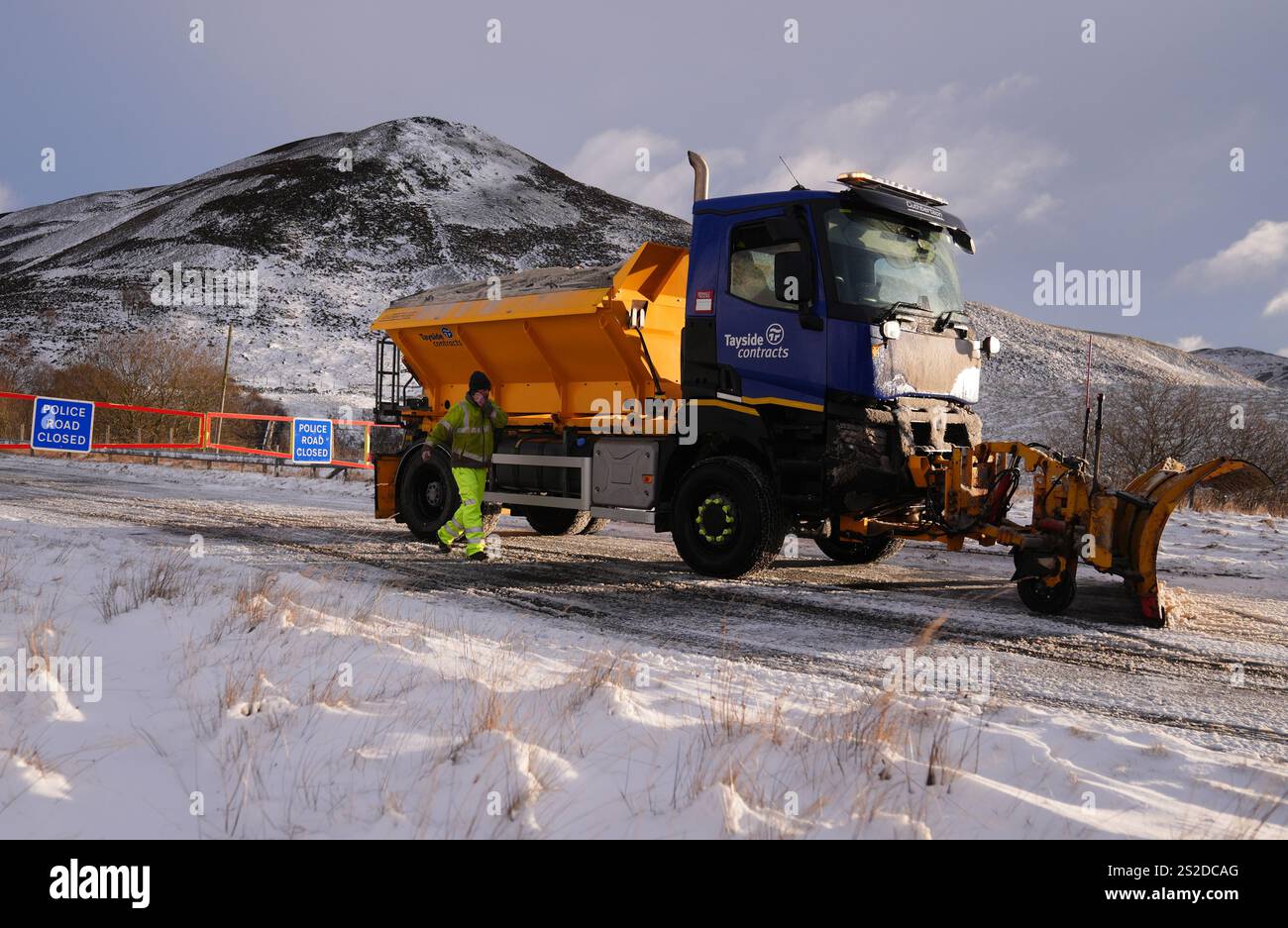 A snow plough driver at the closed snow gates on the A93 in Spittal of ...