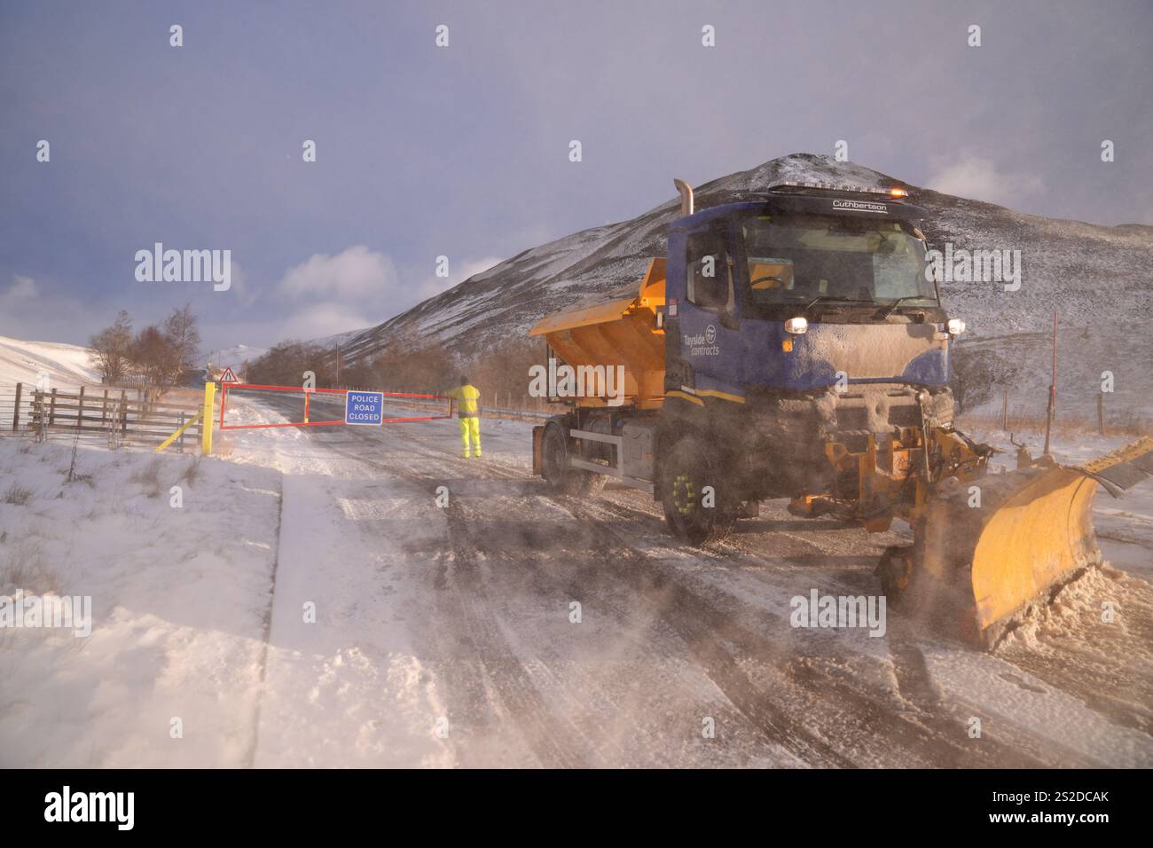 A snow plough driver at the closed snow gates on the A93 in Spittal of ...