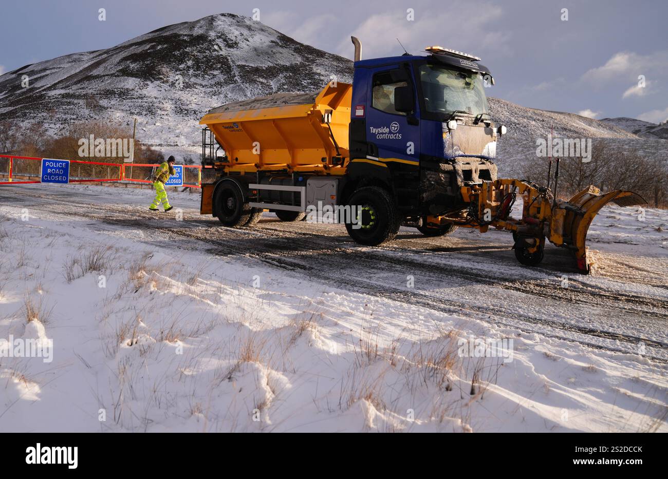 A snow plough driver at the closed snow gates on the A93 in Spittal of ...